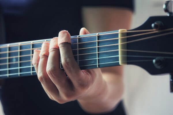 It may be possible to practice guitar through an injury